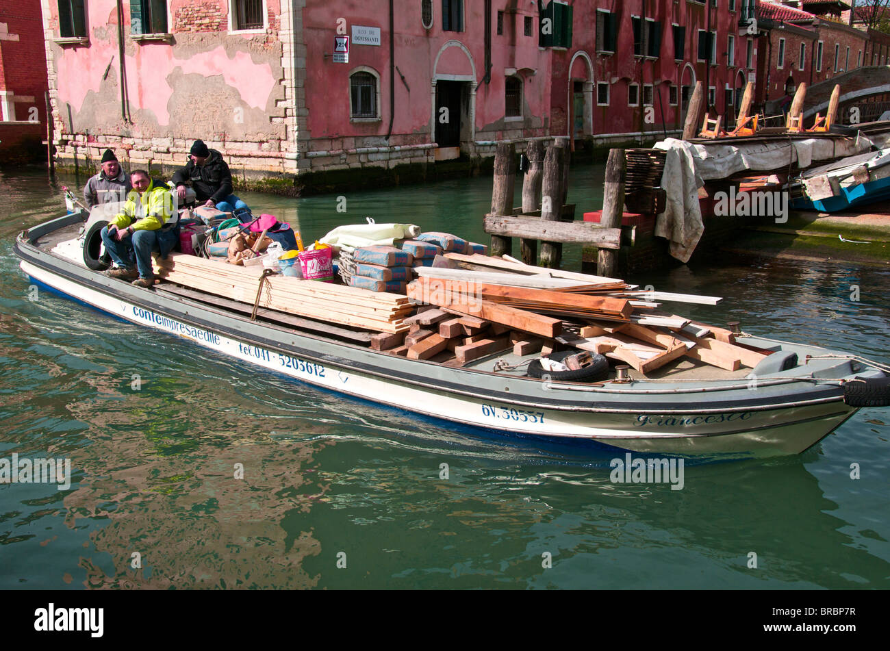 Transporting goods by boat on canal, Venice, Veneto, Italy,Europe Stock ...