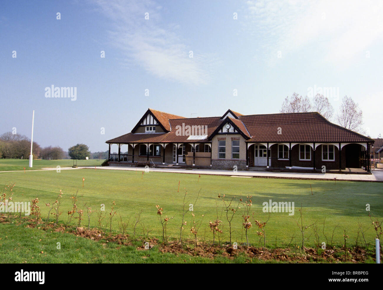 Golf course clubhouse seen across practise green Stock Photo - Alamy