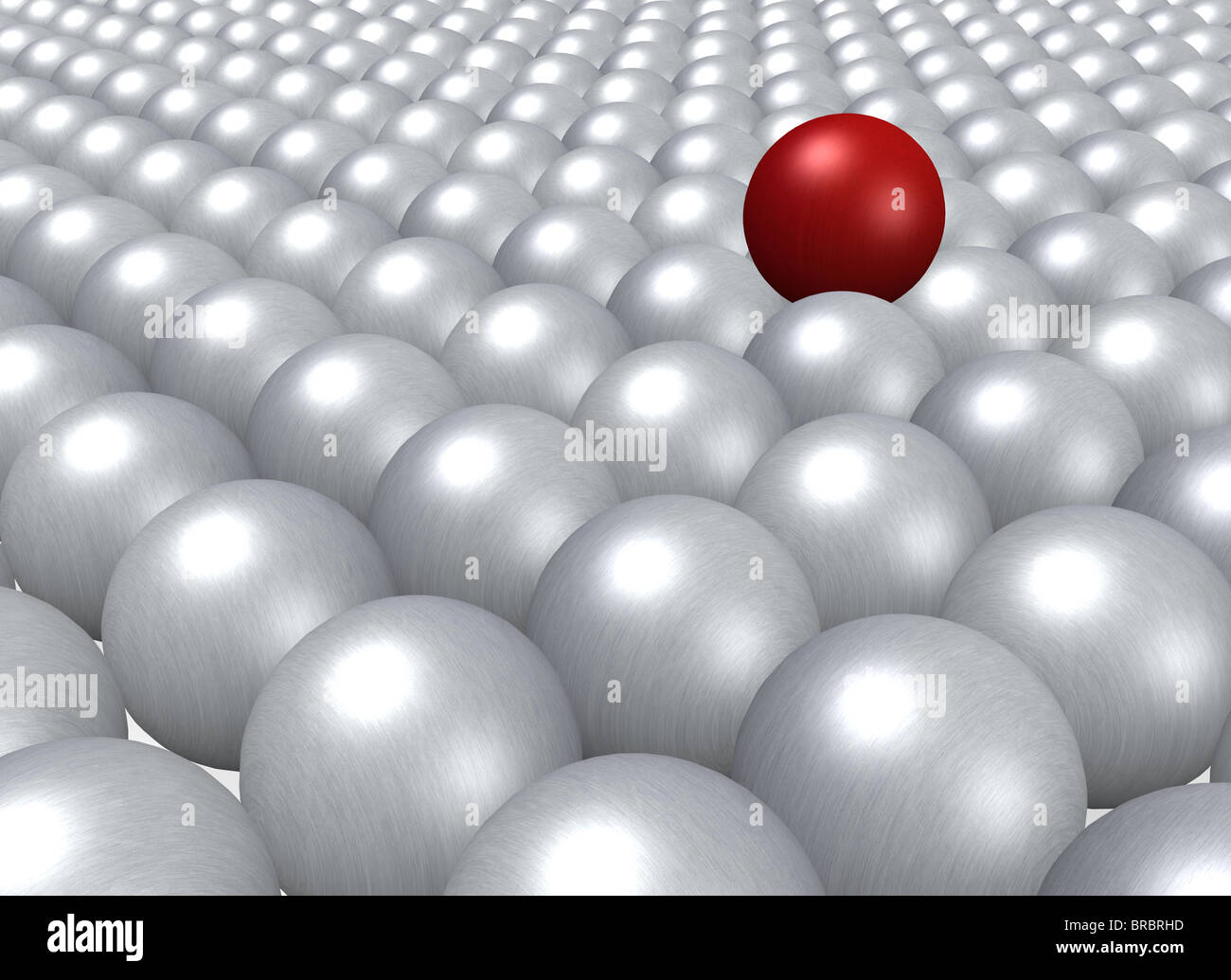 A single red ball lying on a crowd of grey balls Stock Photo - Alamy
