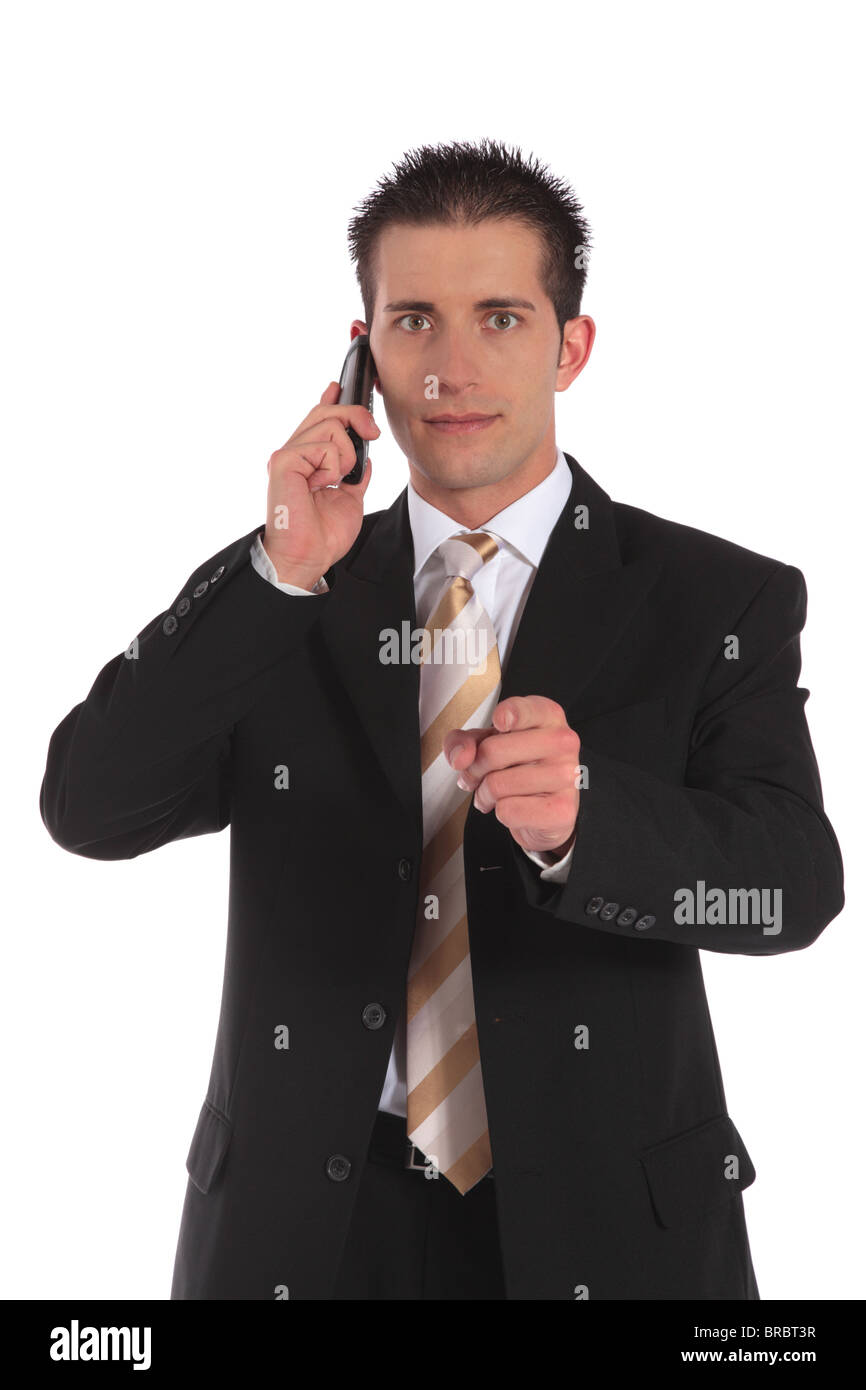 A businessman making a serious phone call and pointing with finger. All ...