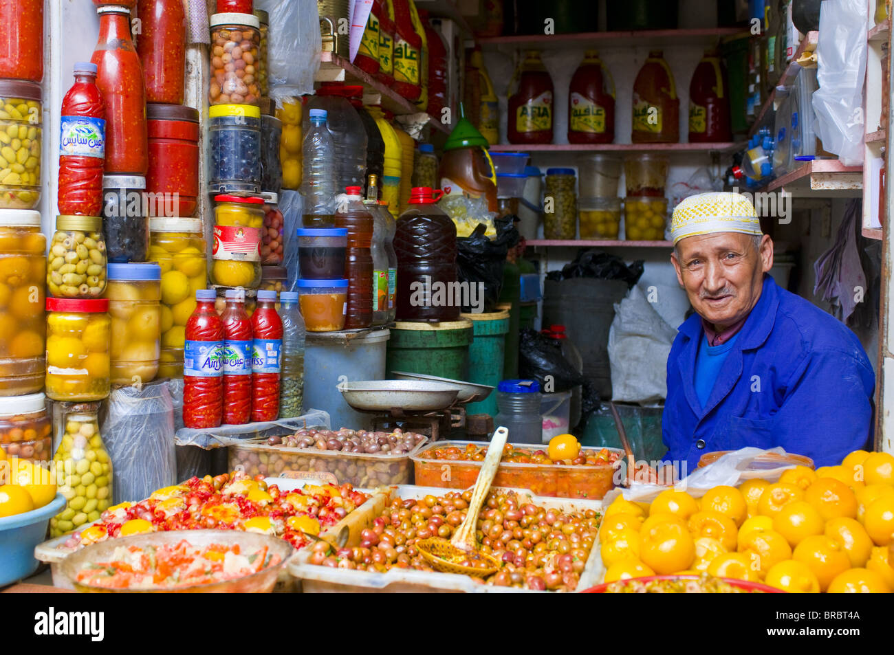 Old man selling vegetables and olives in the bazaar of Safi, Morocco ...