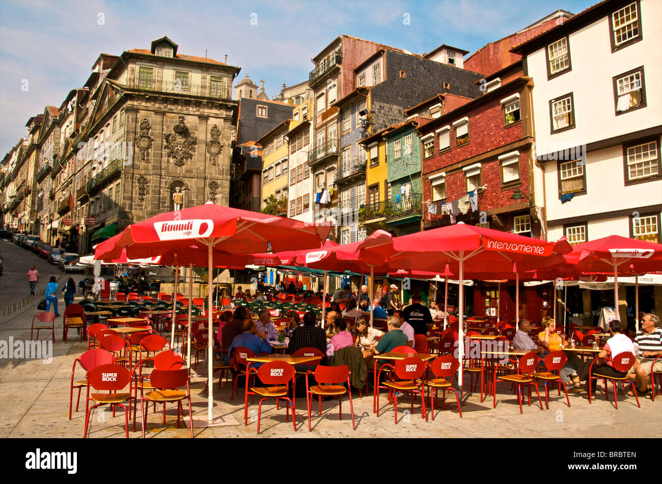 Red sunshades of cafes in Ribeira Square, Porto, Portugal Stock Photo ...