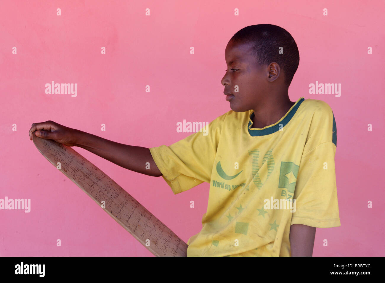 Koranic school pupil holding a prayer tablet, Abene, Casamance, Senegal ...