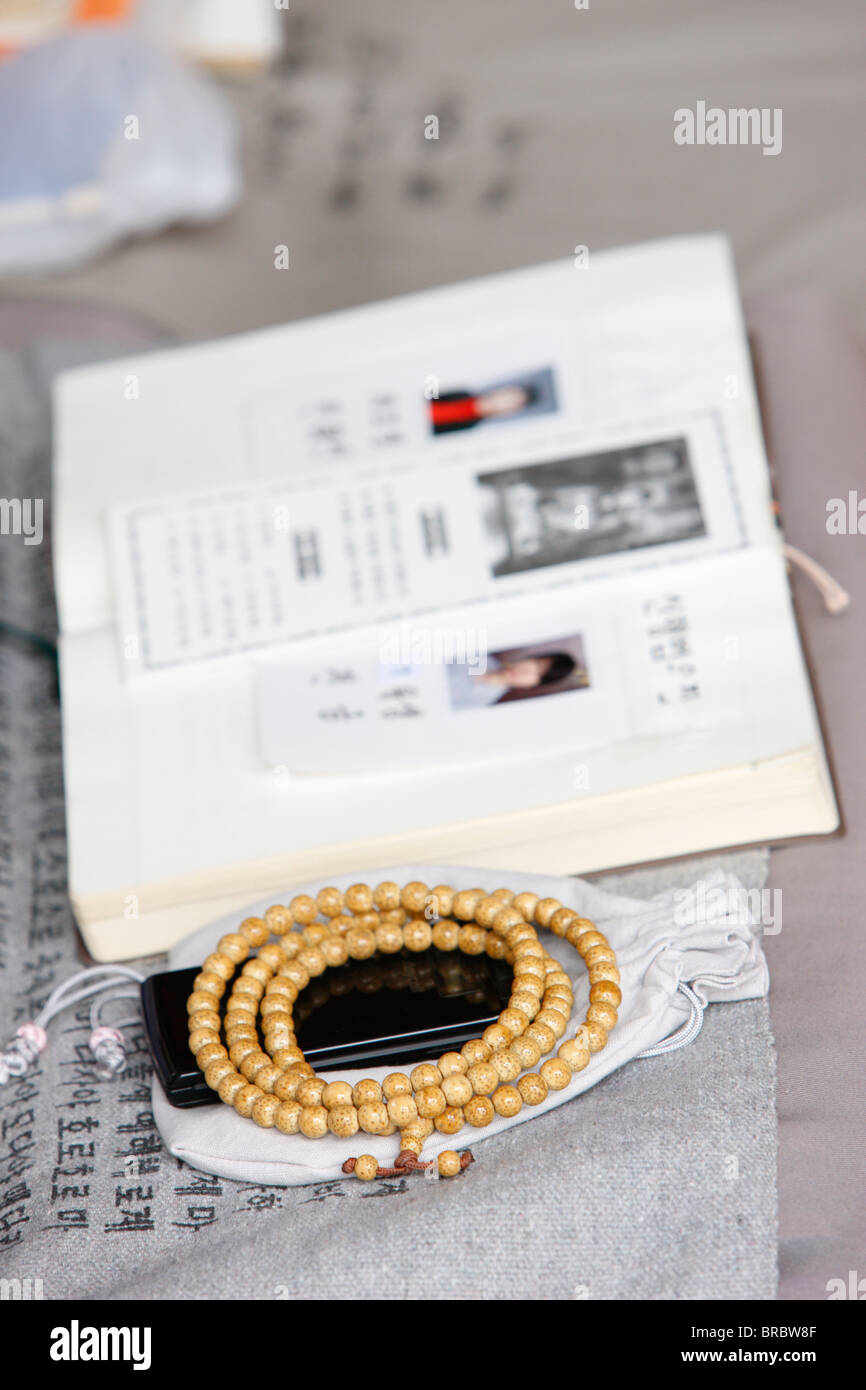 Religious book, prayer beads and mobile phone, Seoul, South Korea Stock ...