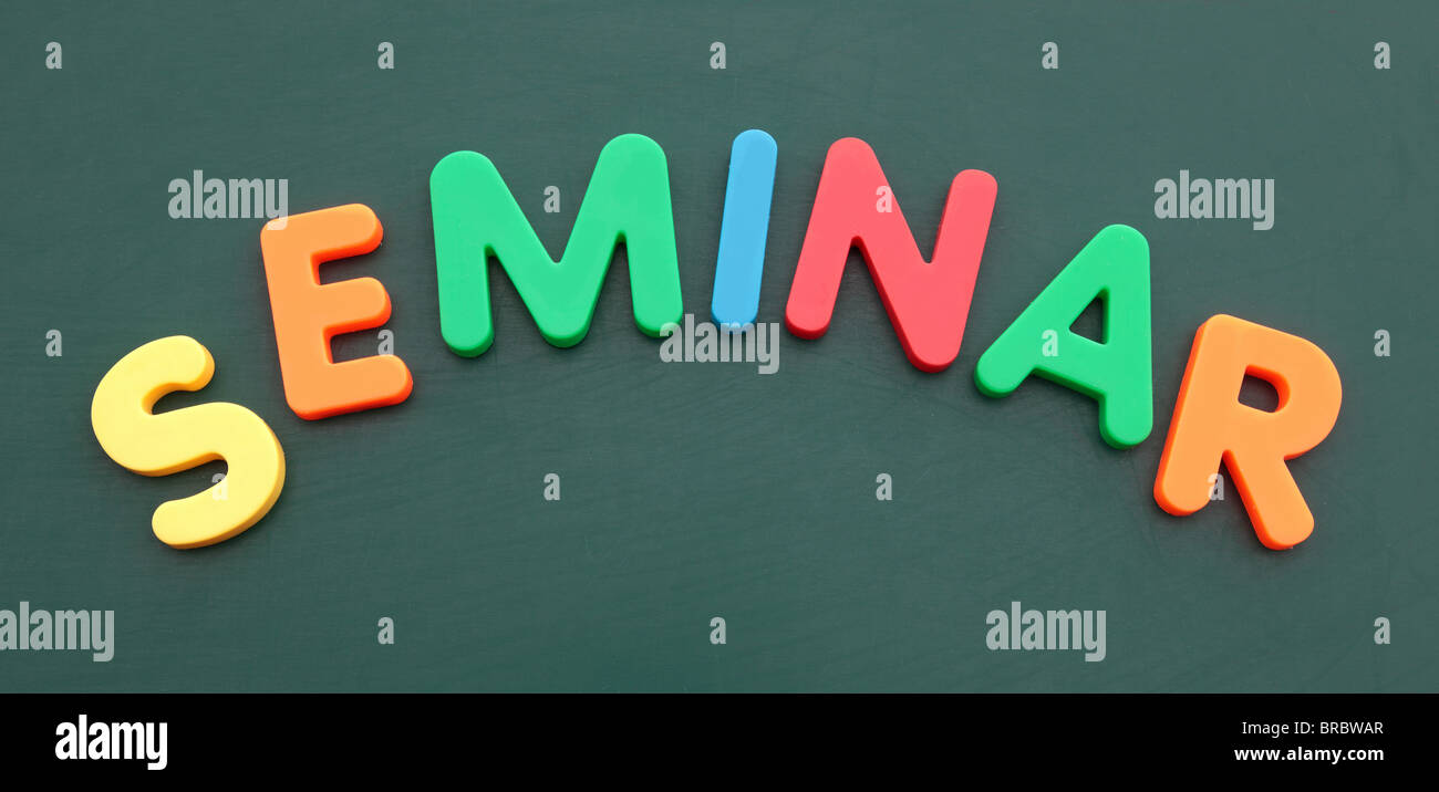 The term seminar built out of colored bold letters on a blackboard ...