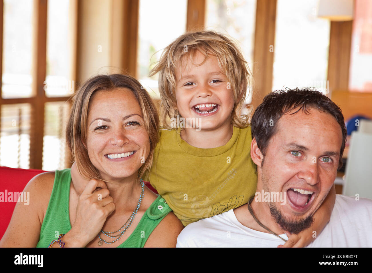 family cuddling on bed Stock Photo - Alamy