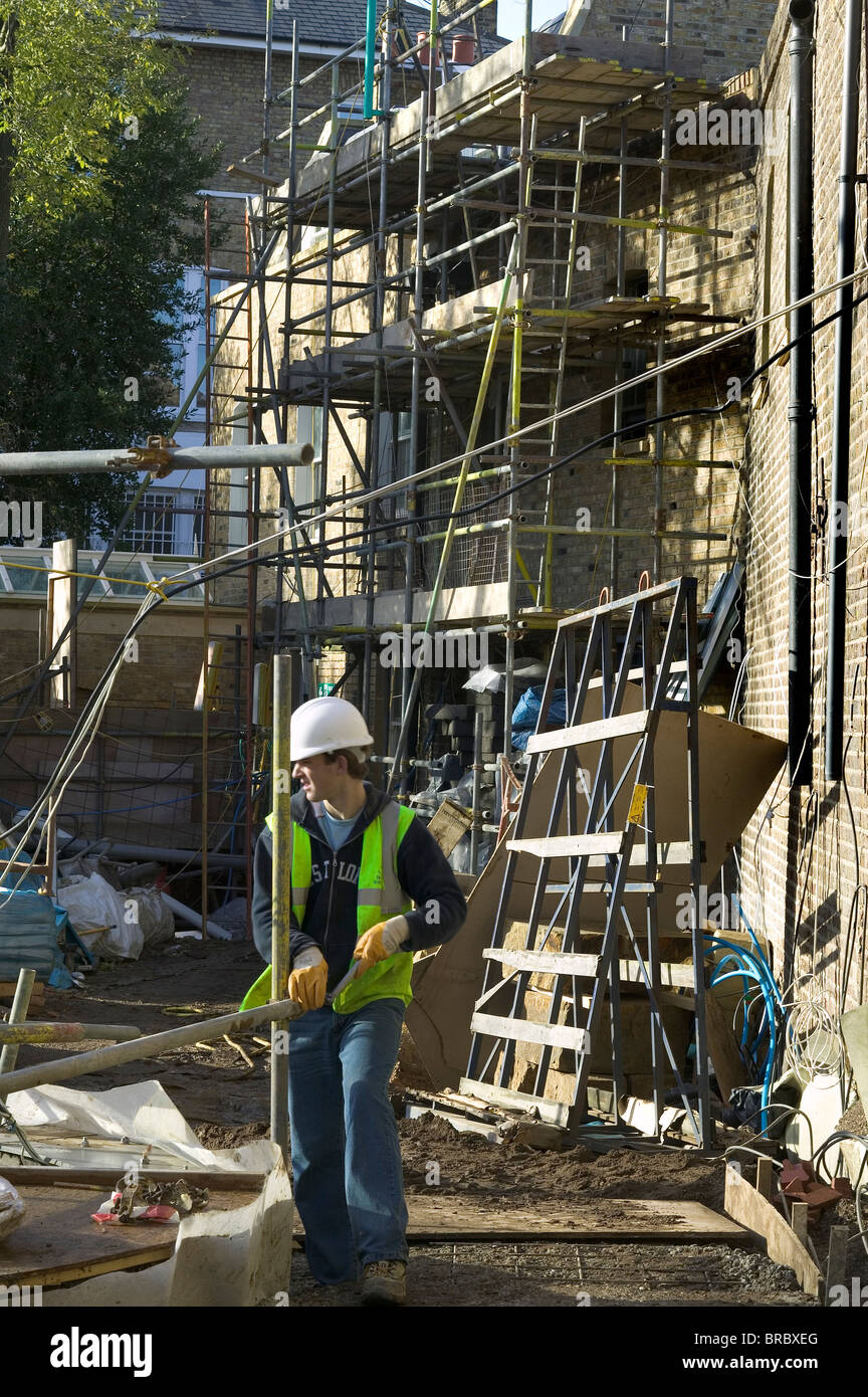 Worker on building site Stock Photo - Alamy