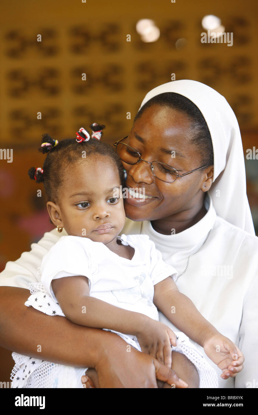 Franciscan sister holding an orphan at nursery and kindergarten run by ...