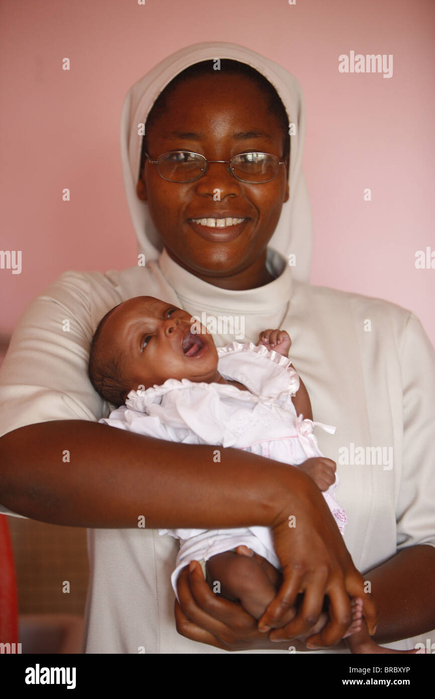 Franciscan sister holding an orphan at nursery and kindergarten run by ...