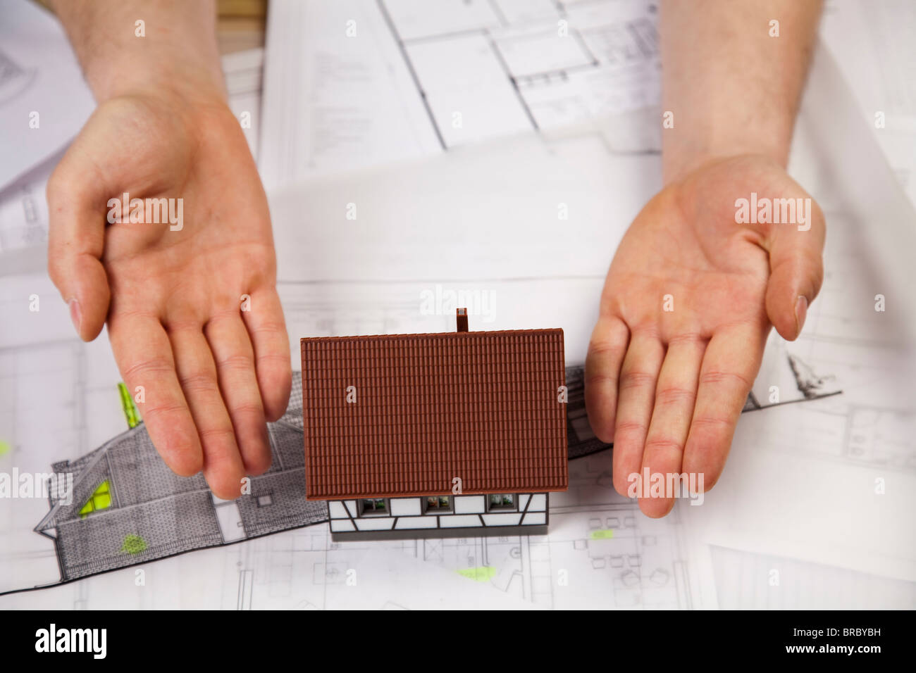 The house in human hands Stock Photo - Alamy