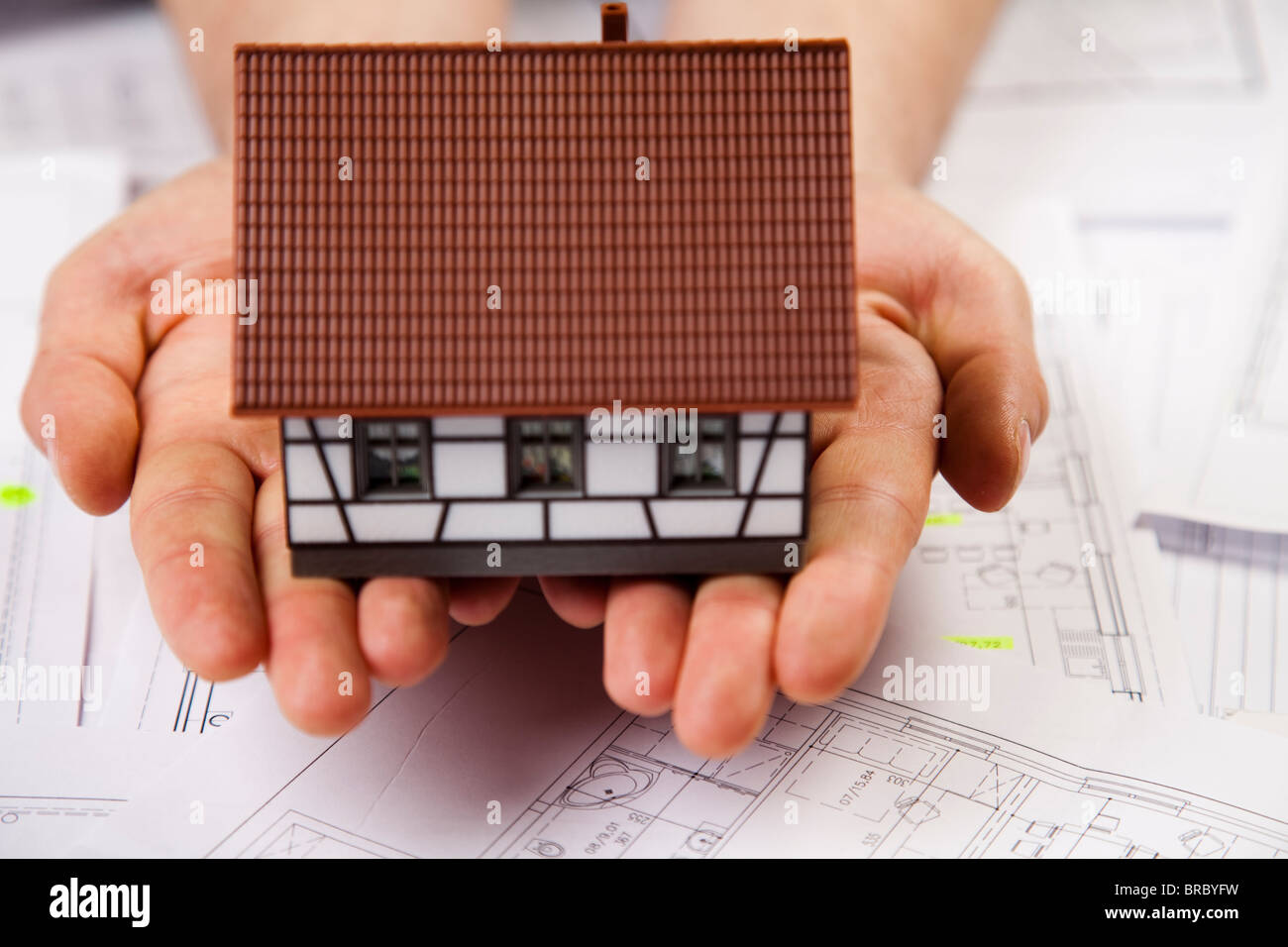 The house in human hands Stock Photo - Alamy