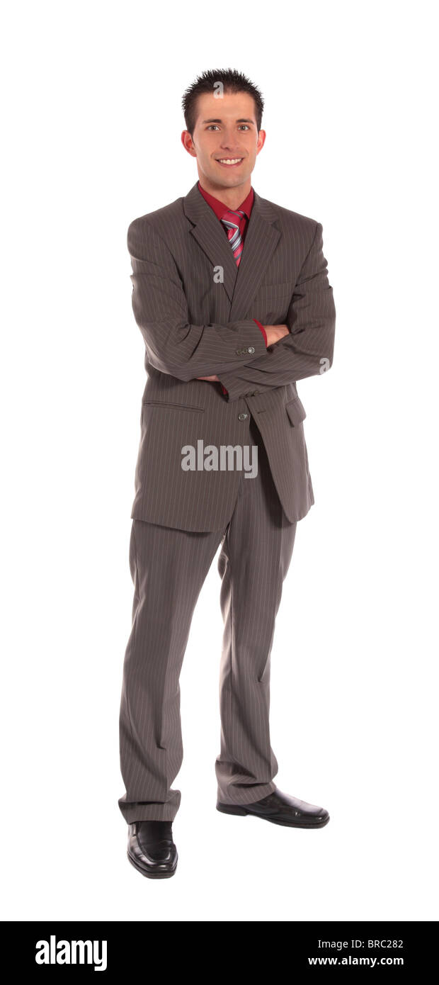 A handsome businessman standing in front of a plain white background ...