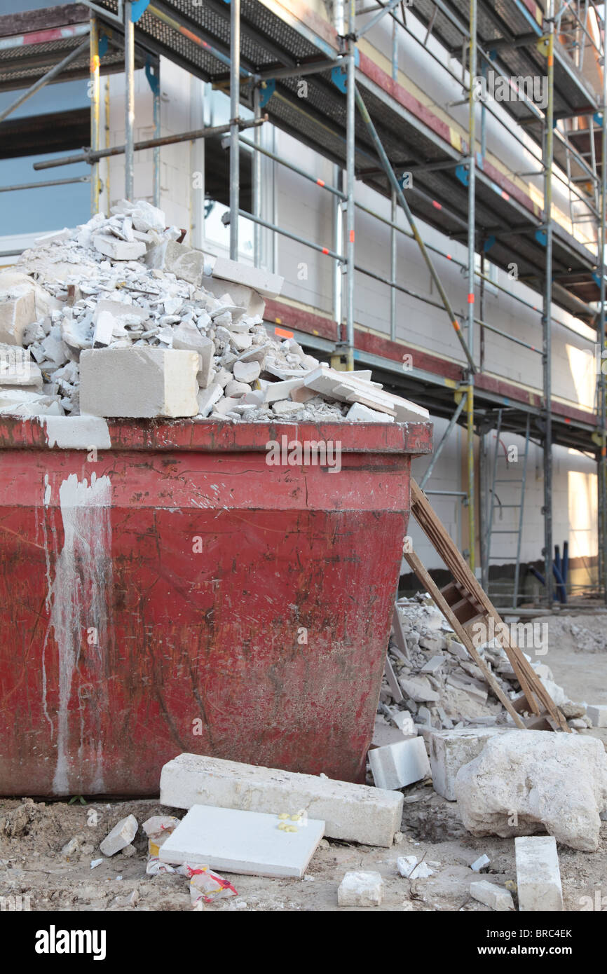 Construction rubble in front of a new residential building beeing build ...