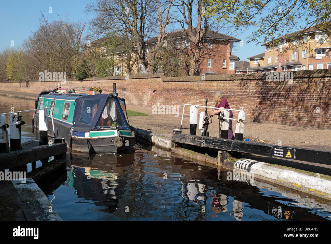 A canal boat making its way through Hanwell Locks on the Grand Union ...