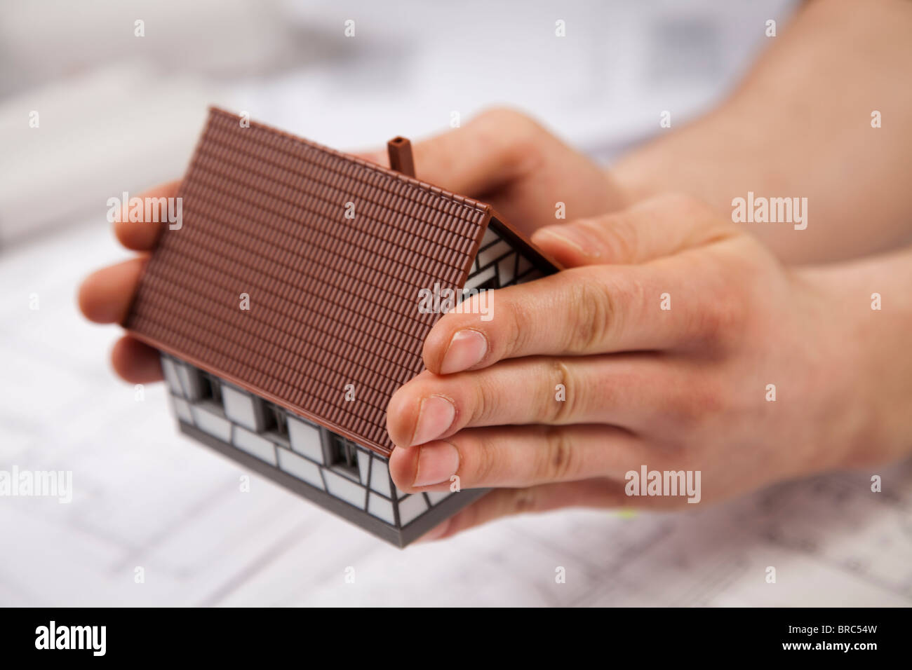 The house in human hands Stock Photo - Alamy
