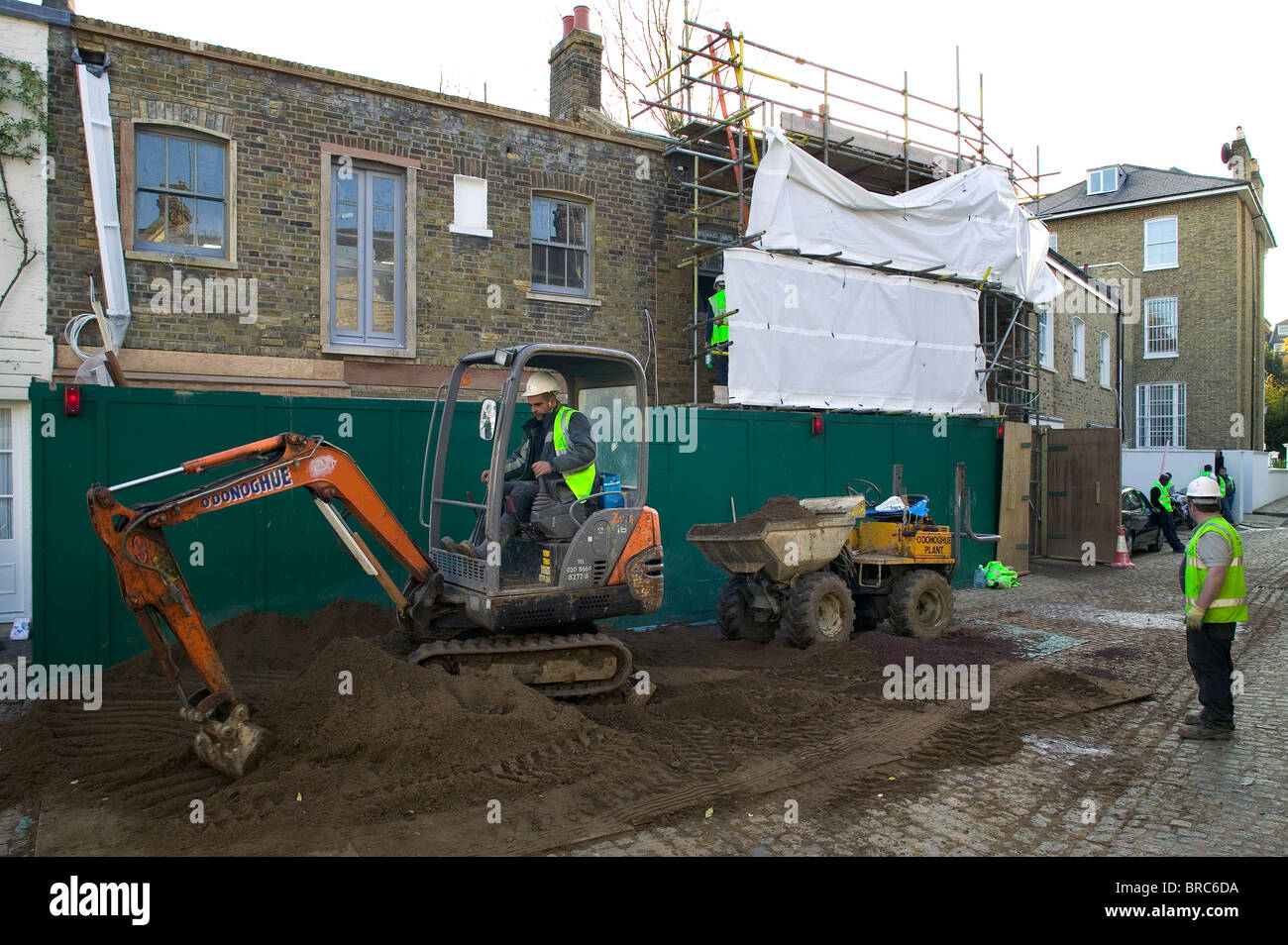 Digging equipment in action on building project Stock Photo - Alamy