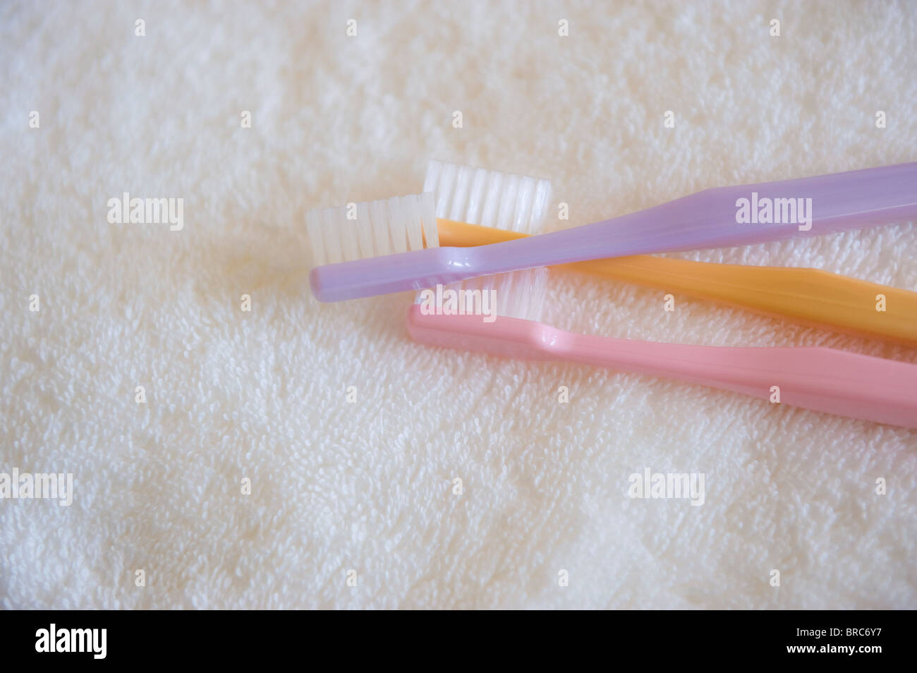 Toothbrush on towel Stock Photo - Alamy