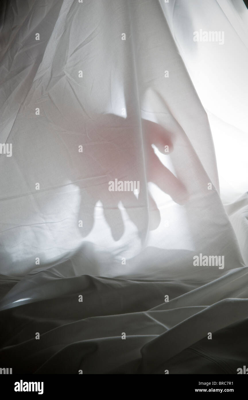 Human hand behind curtain hi-res stock photography and images - Alamy