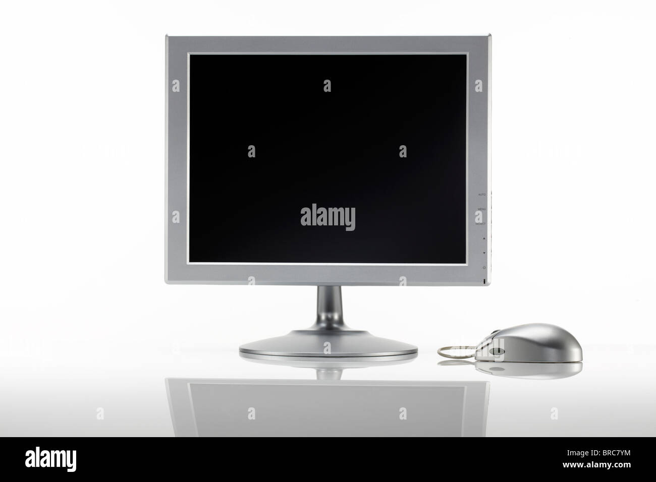 Silver LCD monitor with mouse Stock Photo - Alamy