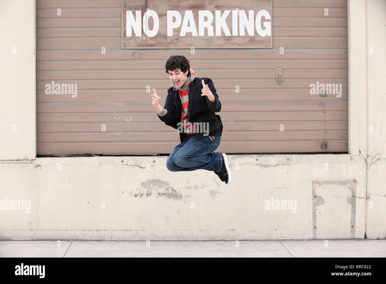 Young Man Having Fun By A Loading Dock; Portland, Oregon, United States ...