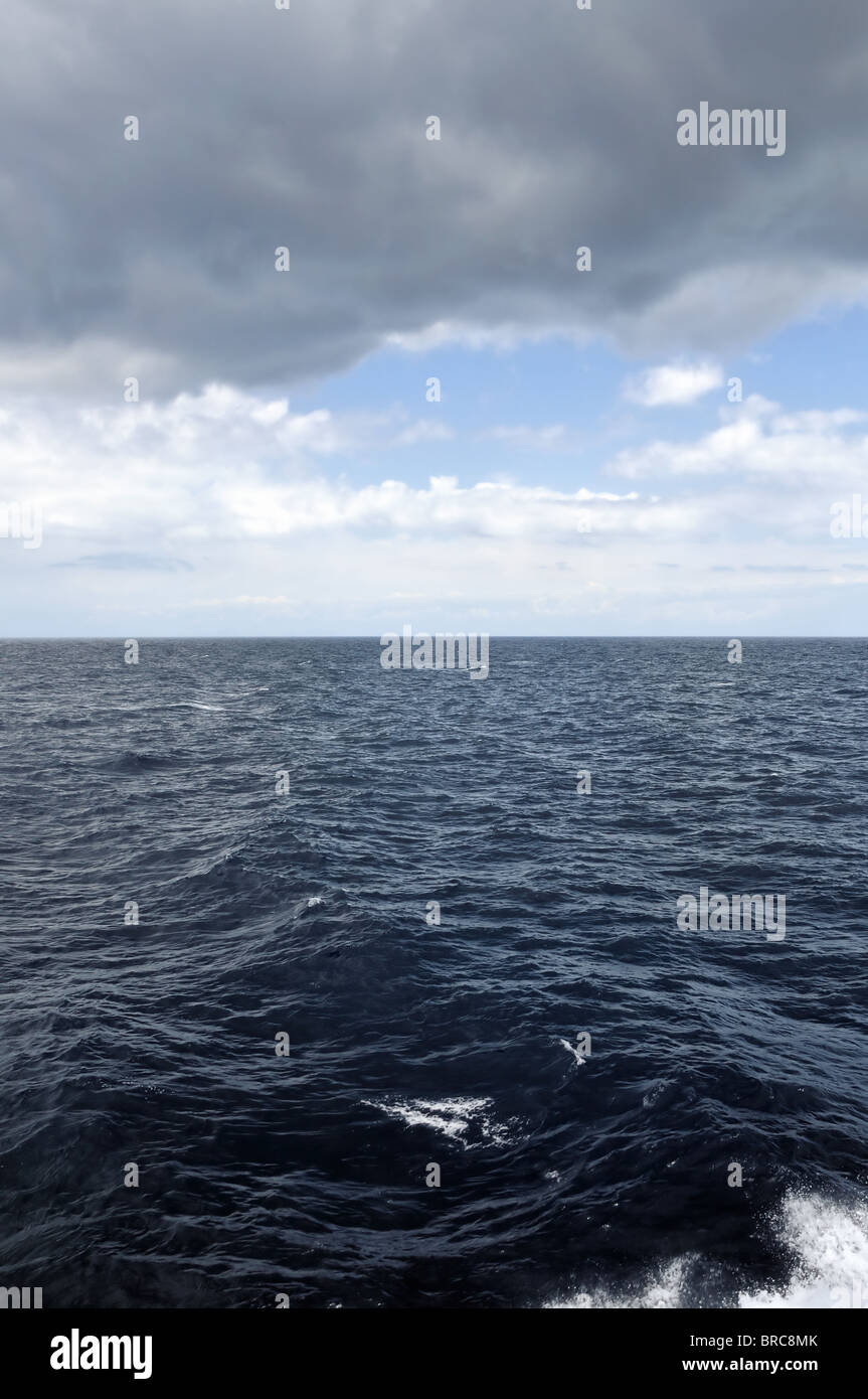 Passing through the storm. Restless deep sea water and clear coast ...