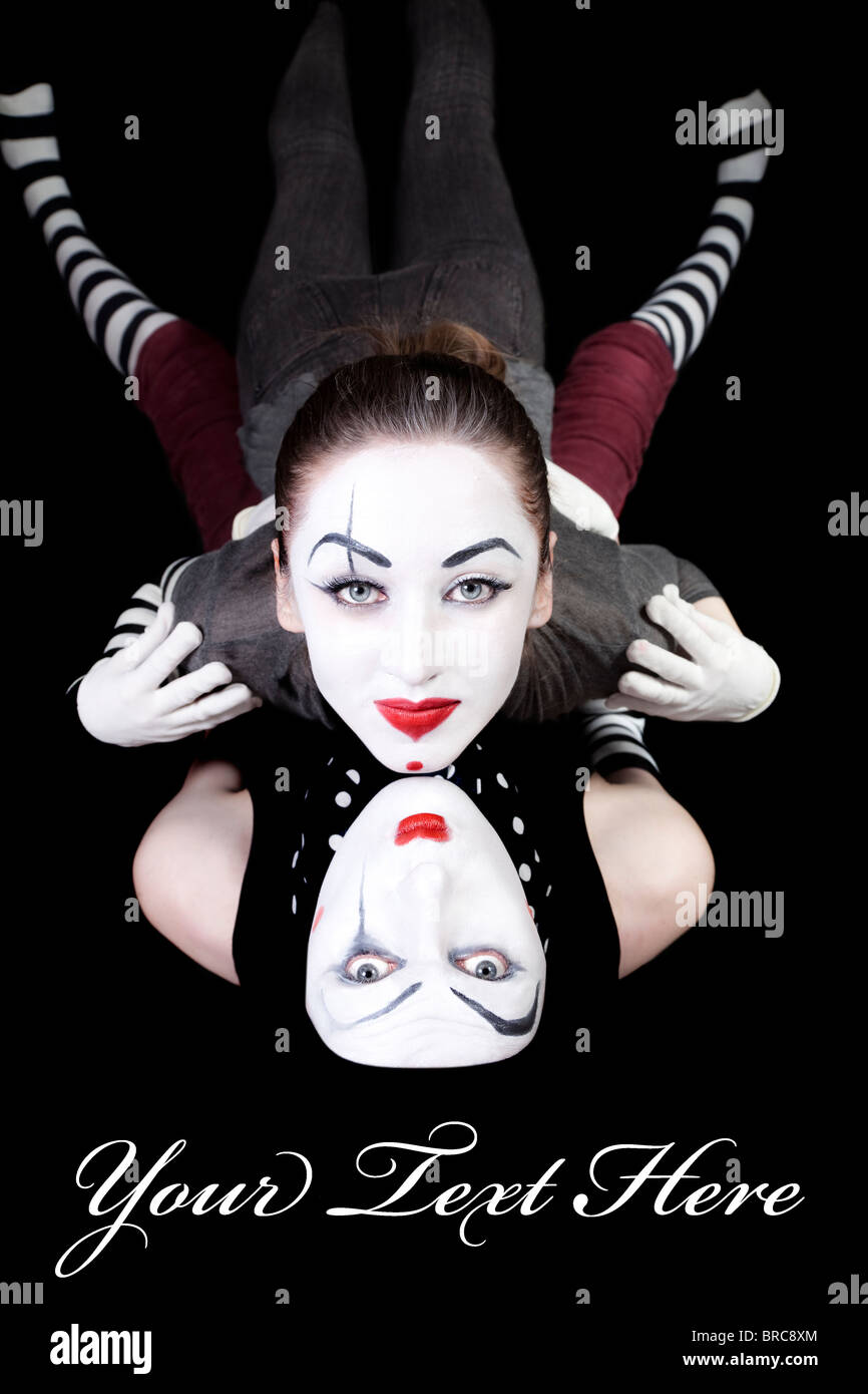 Portrait of two mimes on black background Stock Photo - Alamy