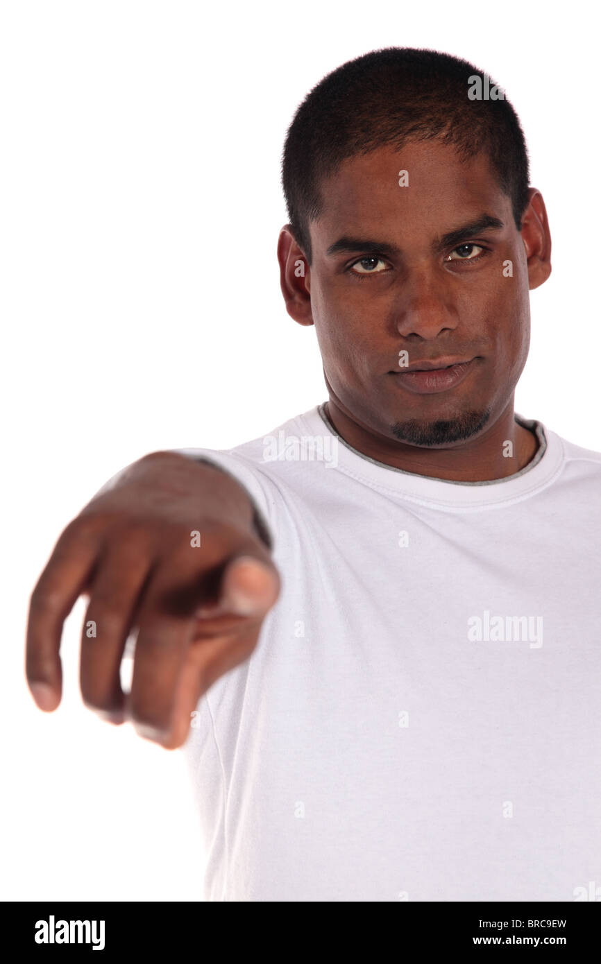 An attractive dark-skinned man pointing with finger. All on white ...