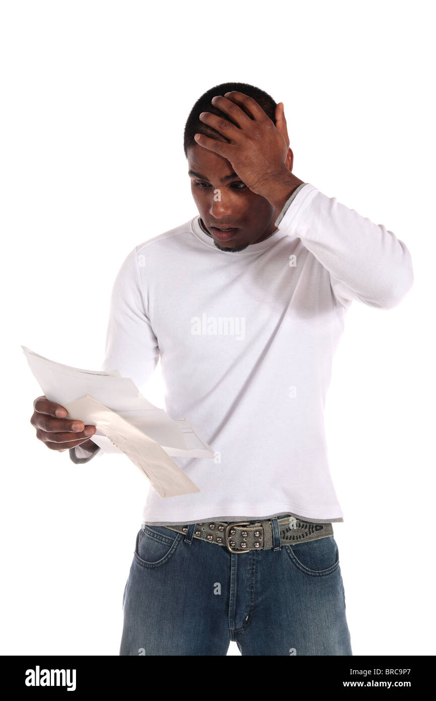An attractive dark-skinned man getting bad news via mail. All on white ...