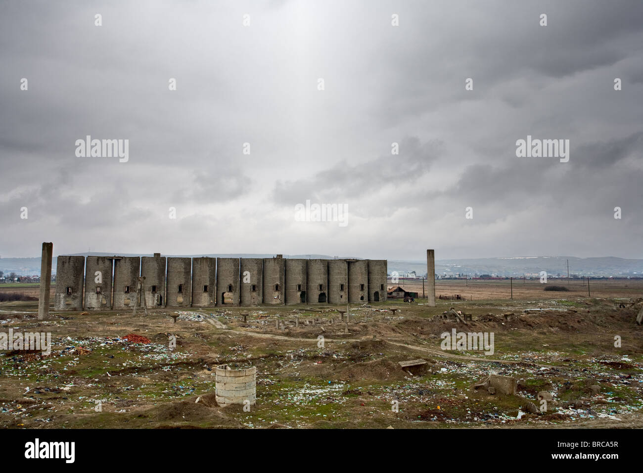 Abandoned facility under moody cloudy dark sky, image of decrepitude ...