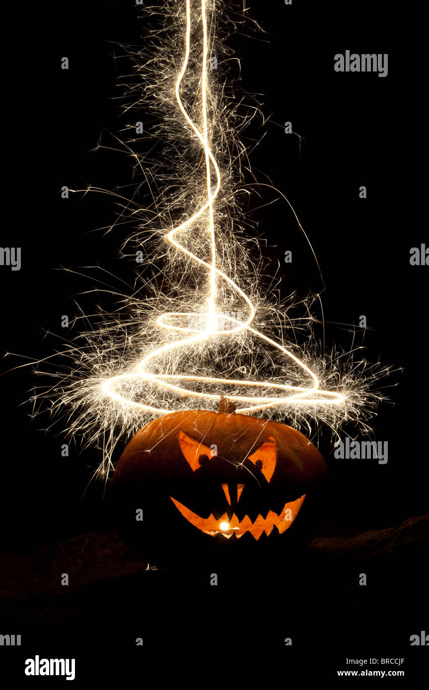 Halloween pumpkin, Jack o lantern, fire face and fireworks Stock Photo ...
