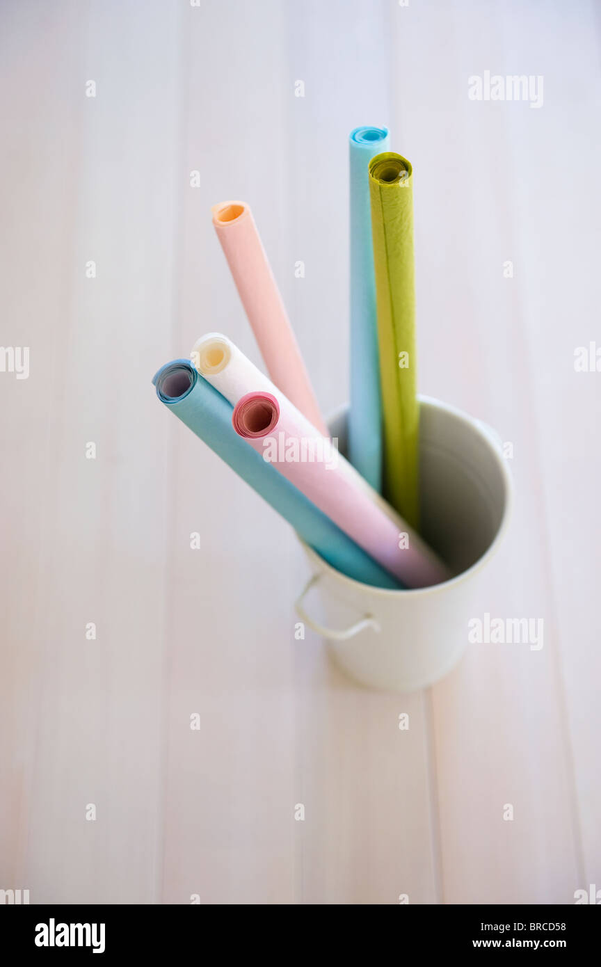 Rolled wrapping paper in a pitcher Stock Photo - Alamy