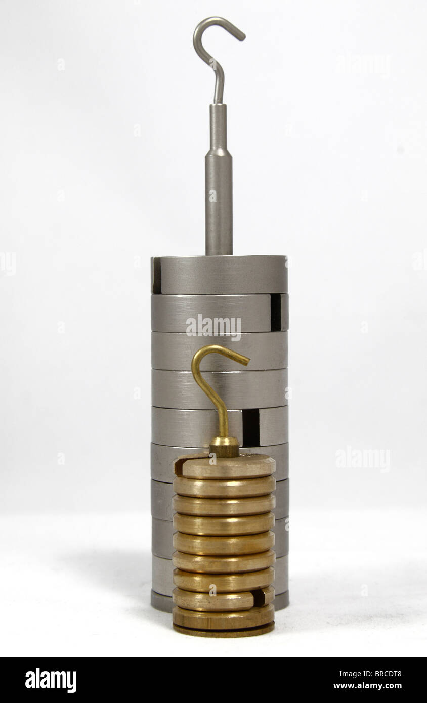 A pair of school used masses on hooked cradles (silver 50g and brass ...