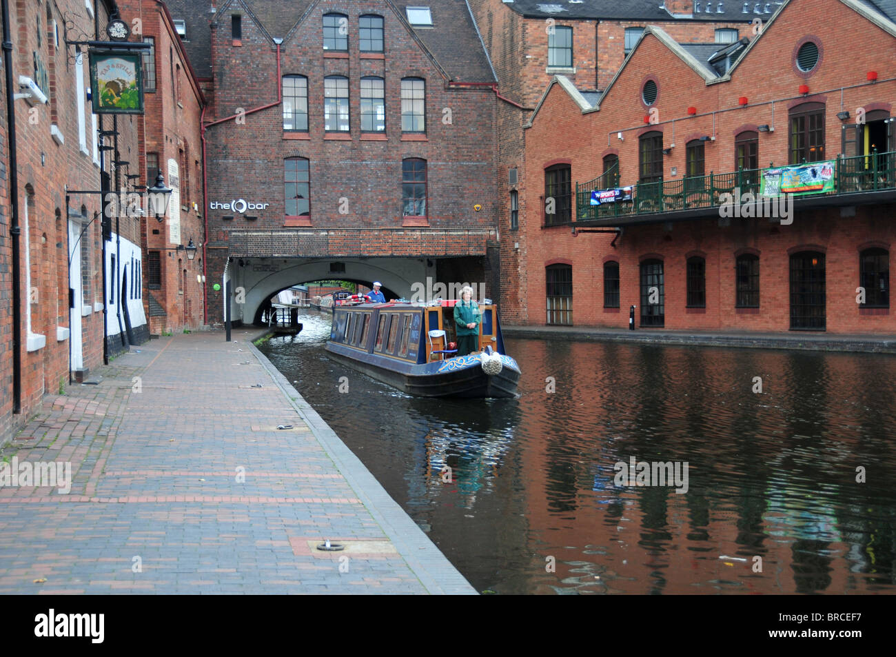 Narrowboat passing under bridge on Birmingham Canal near Gas Street ...