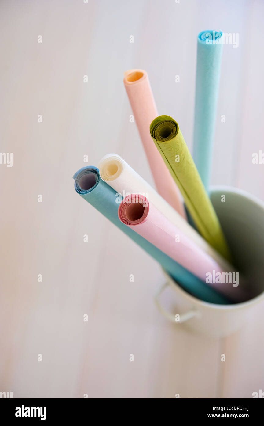 Rolled wrapping paper in a pitcher Stock Photo - Alamy