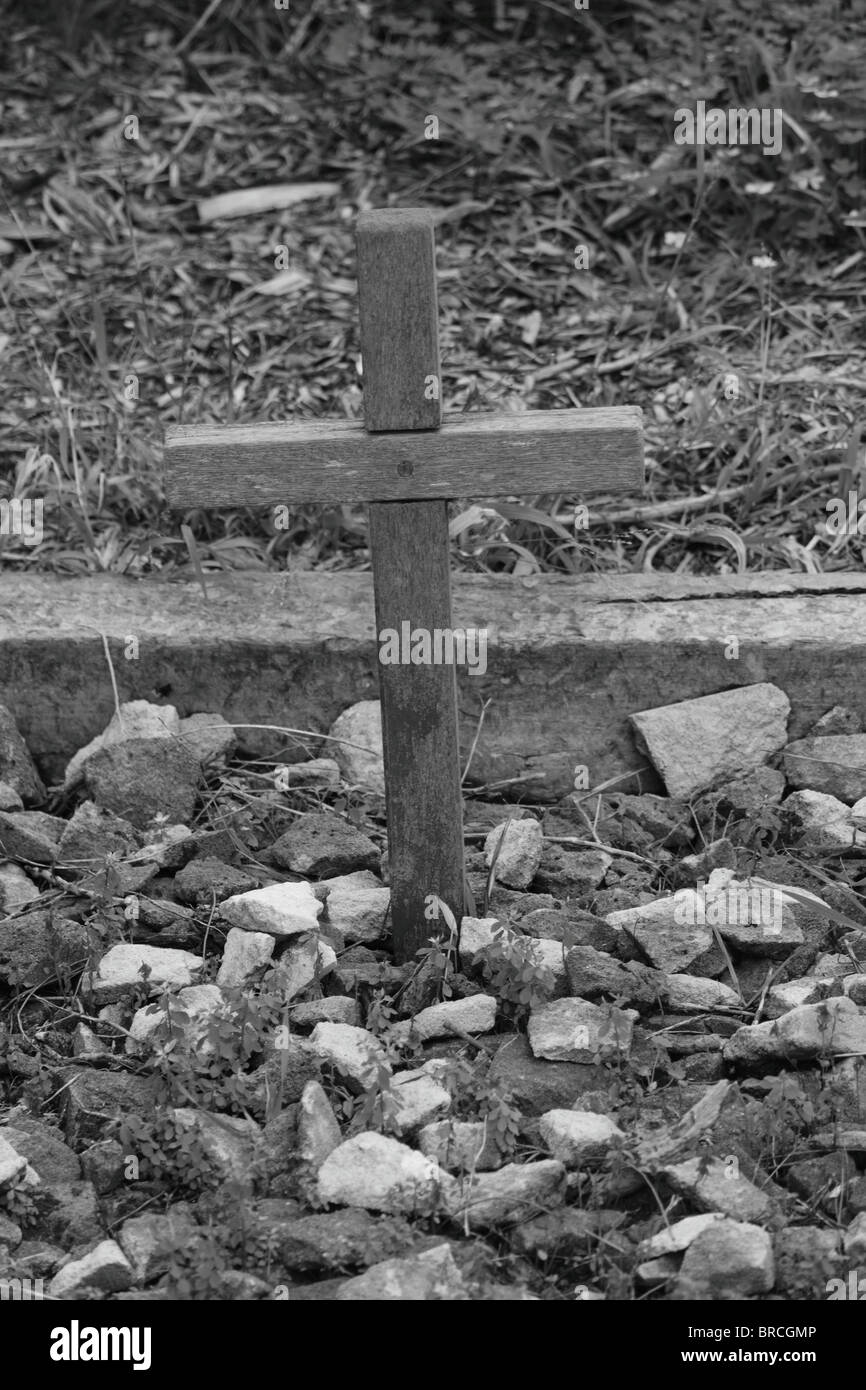 CRUDE HOMEMADE CROSS MARKING A ROCKY GRAVE VERTICAL BLACK AND WHITE ...