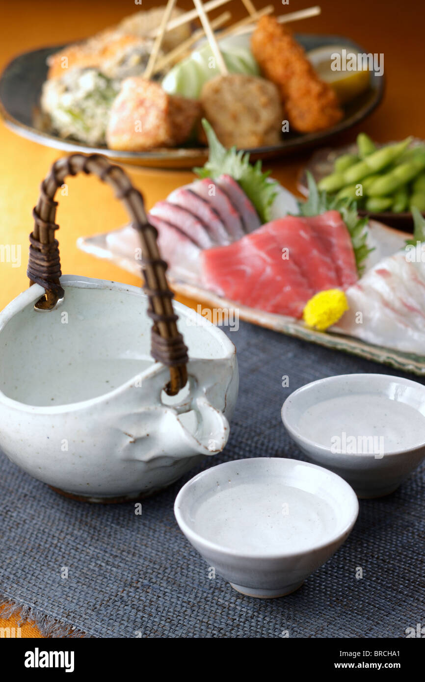 Sake and dishes Stock Photo - Alamy