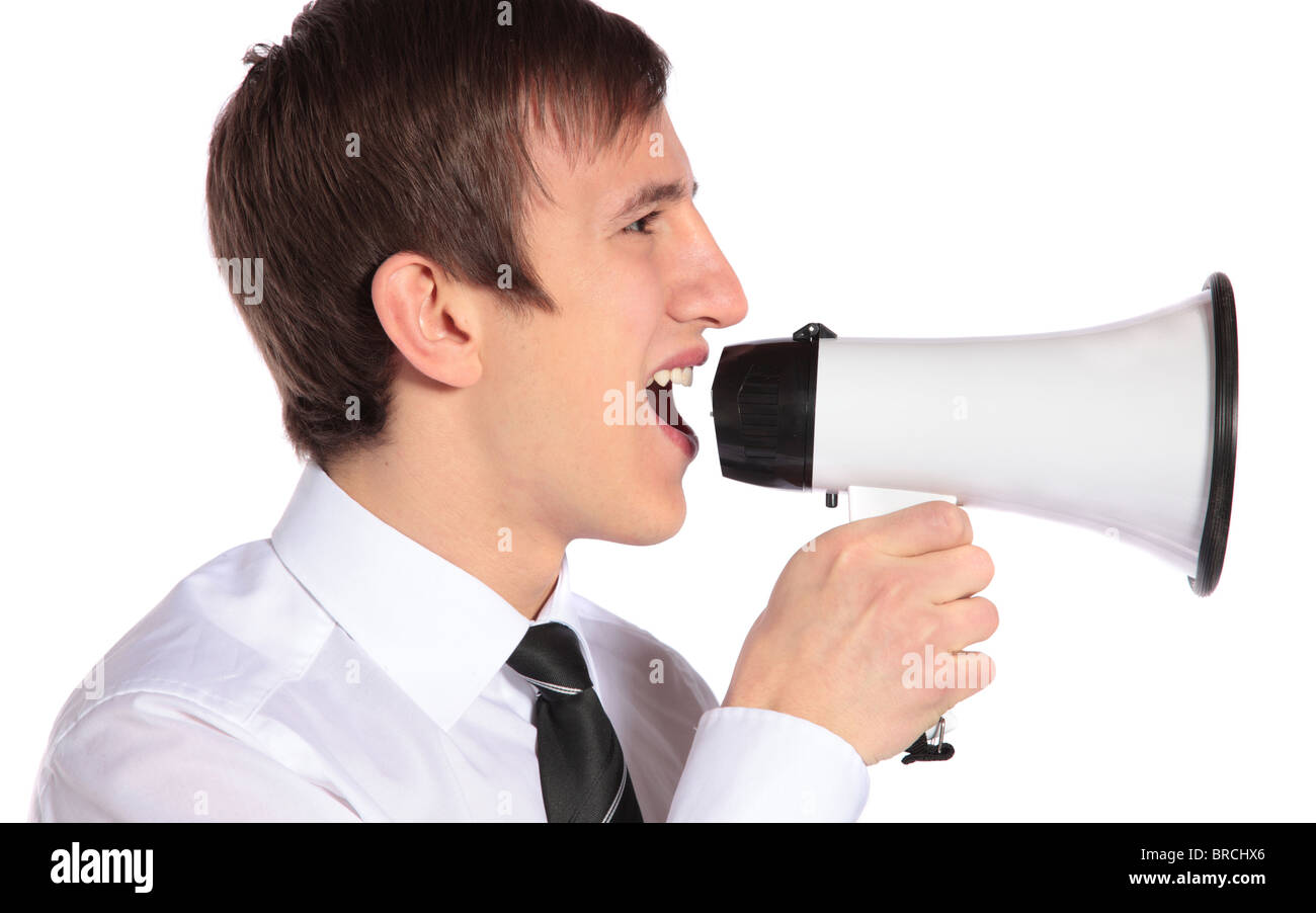 A young businessman using a megaphone. All isolated on white background ...