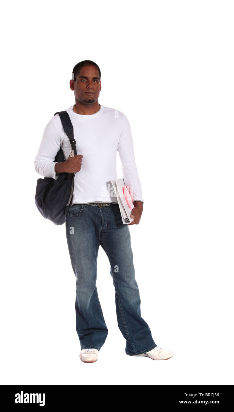 An attractive dark-skinned student standing in front of a plain white ...