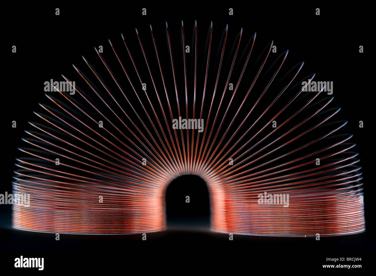 Slinky spring wire curves toy hi-res stock photography and images - Alamy