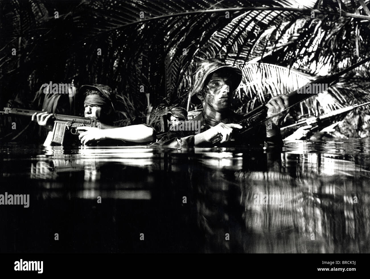Black and white image of two soldiers hiding in water Stock Photo - Alamy