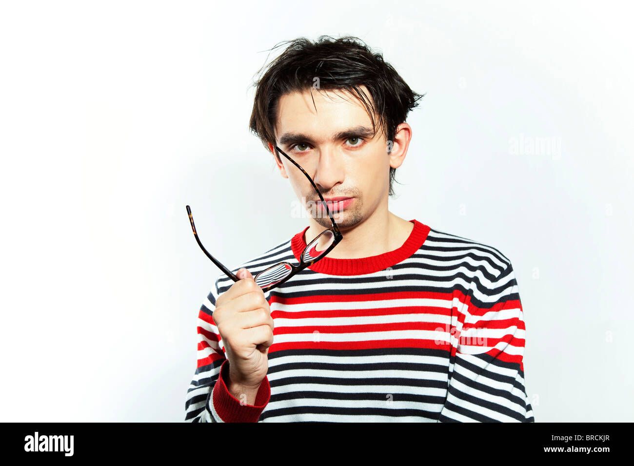 thoughtful young man with glasses Stock Photo - Alamy