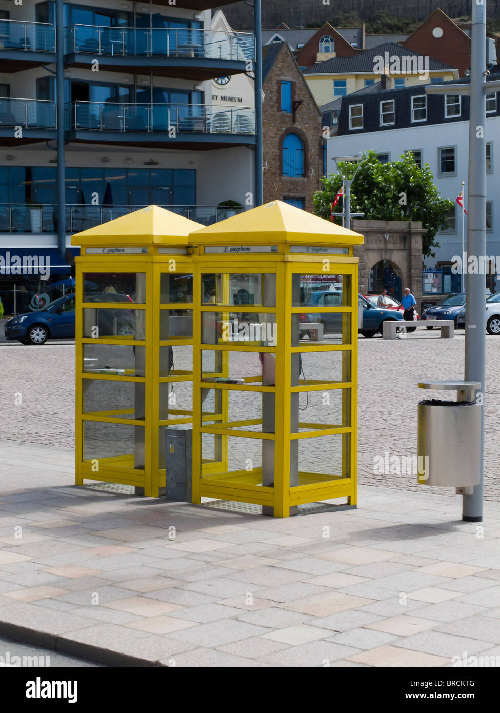 Public yellow telephone boxes in the centre of St. Helier, Jersey Stock ...