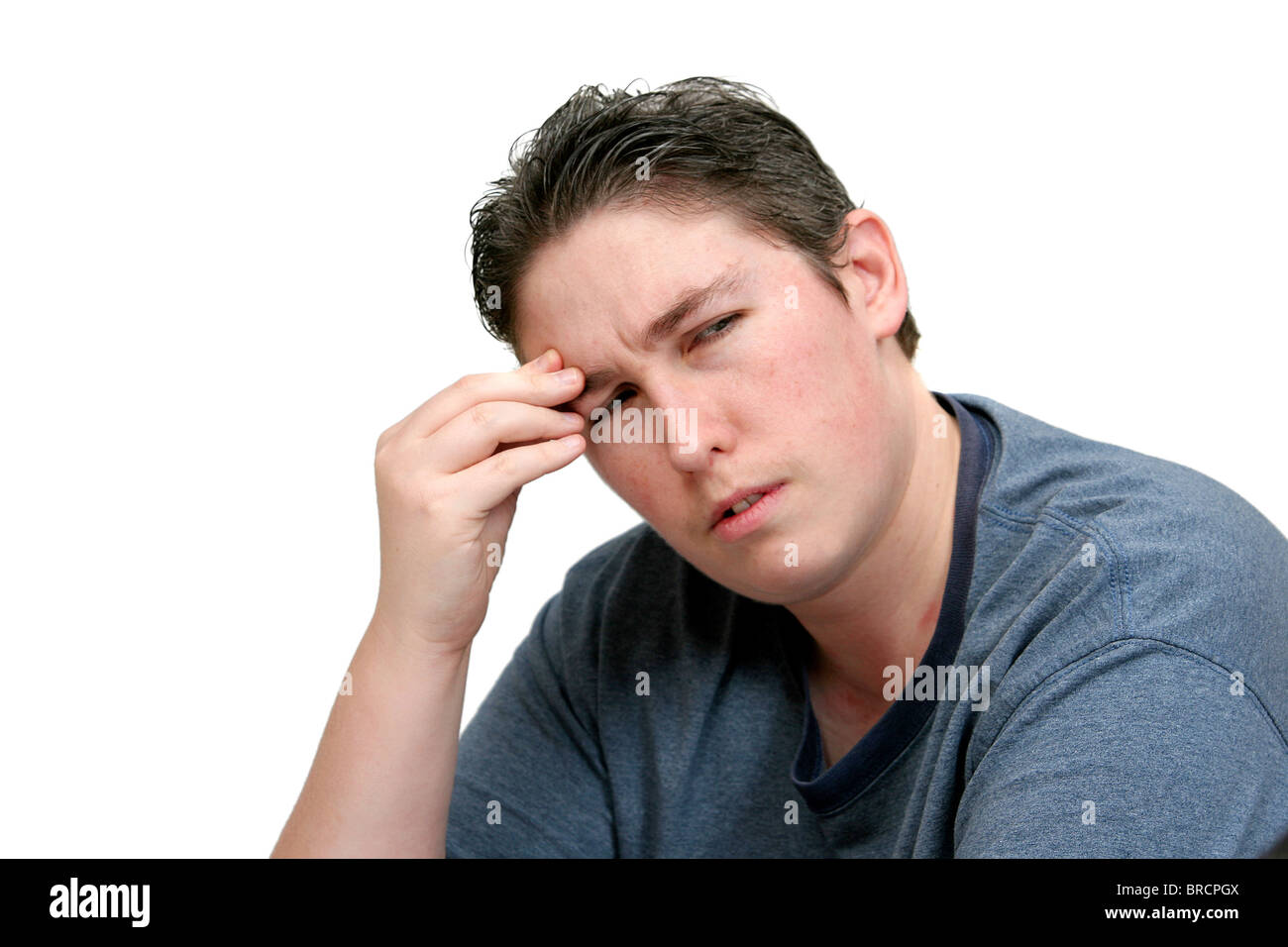 one adult man with a headache or head pain holding his head in worry or ...