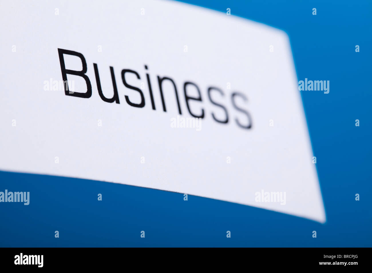 Business on peace of paper pierced in hook Stock Photo - Alamy