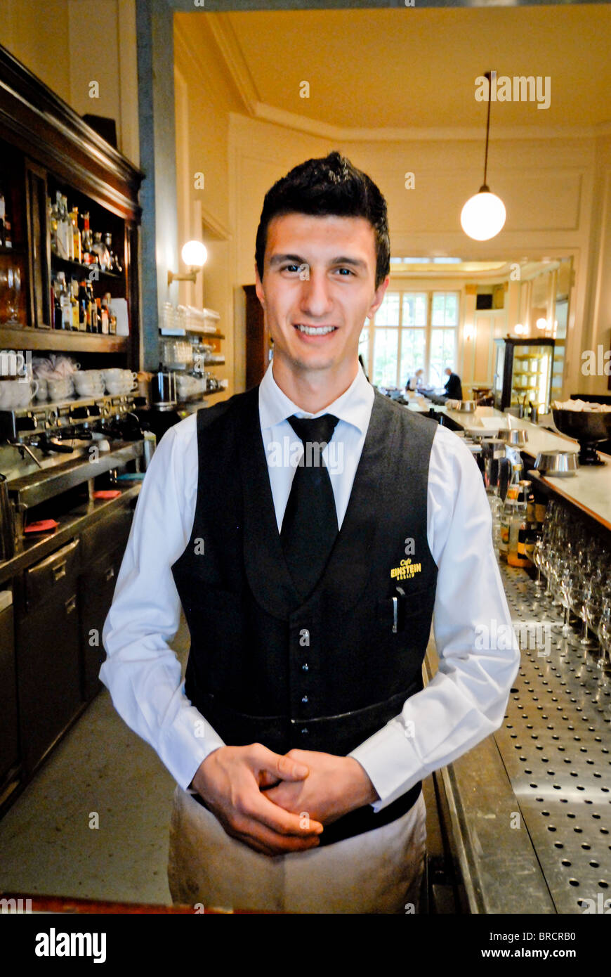 Unifromed Waiter in traditional bar, Berlin, Germany Stock Photo - Alamy