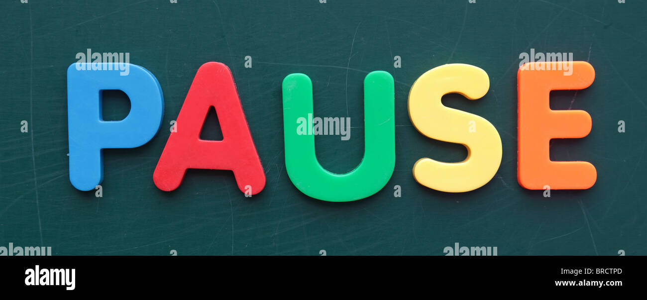 The term pause in colorful letters on a blackboard Stock Photo - Alamy