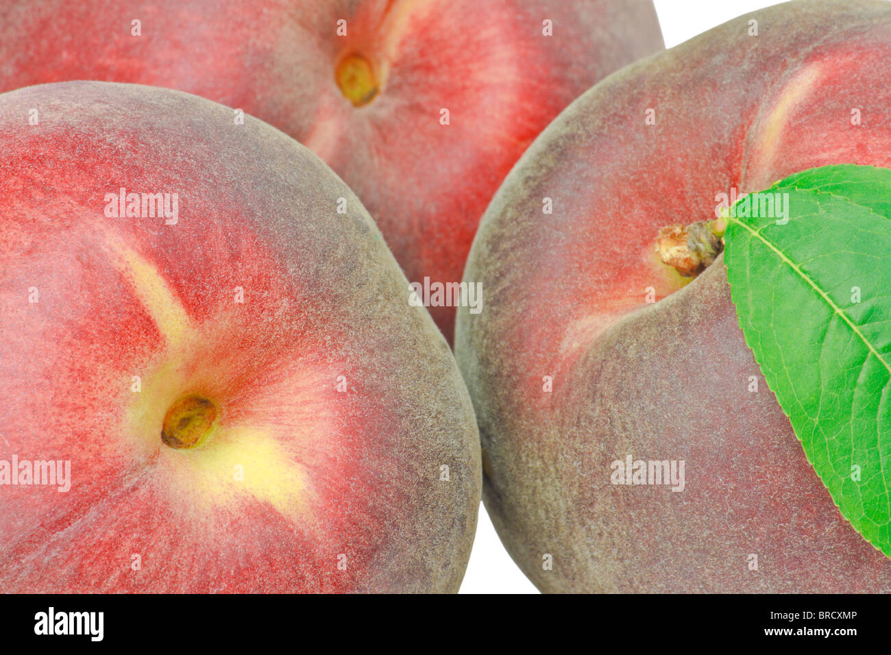 Three juicy peaches isolated on white Stock Photo - Alamy