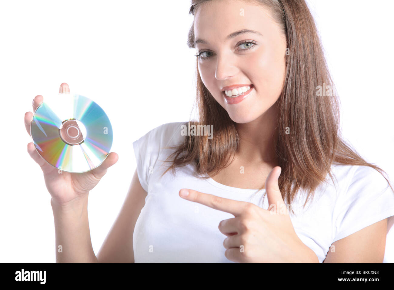 An attractive young woman holding a CD-Rom or DVD. All isolated on ...