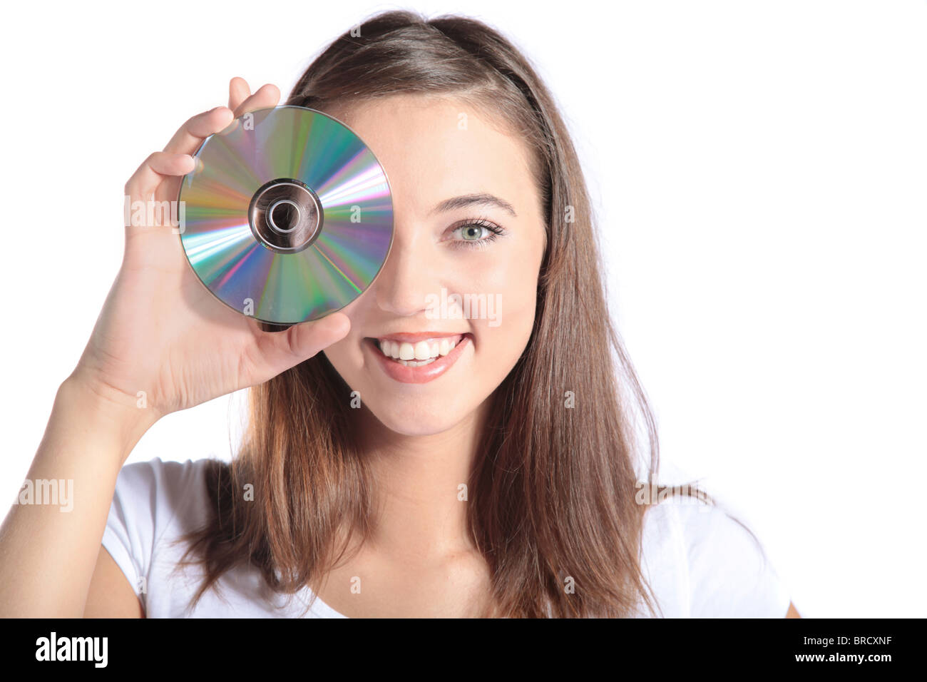 An attractive young woman holding a CD-Rom or DVD. All isolated on ...