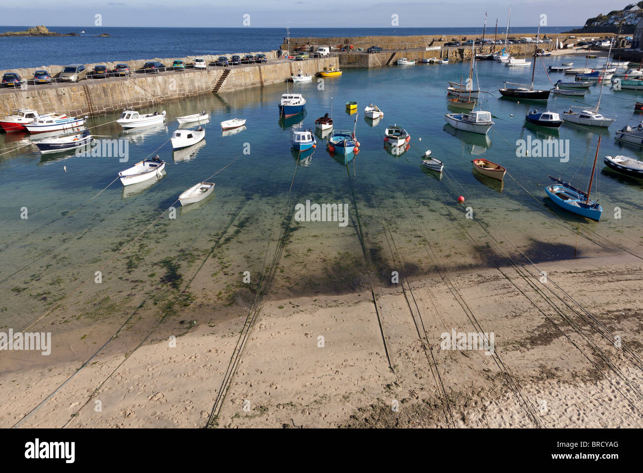Fishing boats moored in Mousehole harbour, Cornwall England Stock Photo ...